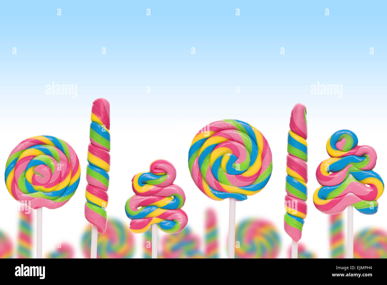 Fantasy sweet candy land with lollies on blue background Stock Photo ...