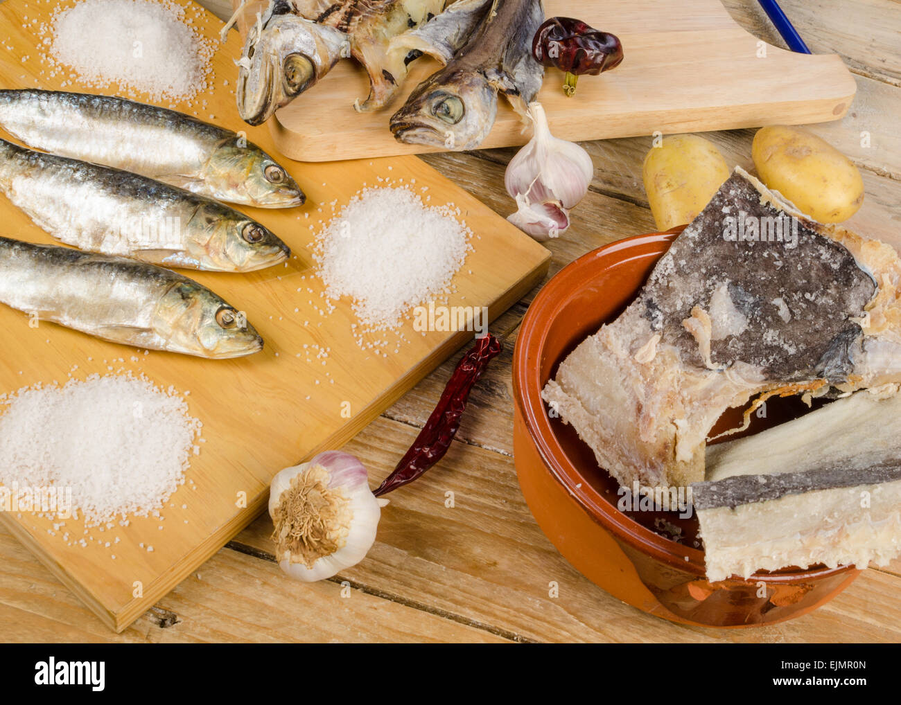 Assorted salt cured fish with ingredients for Mediterranean recipies ...