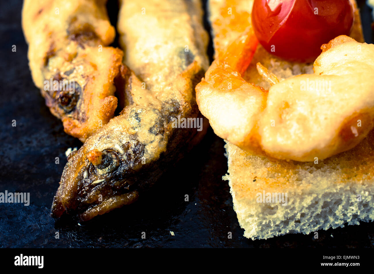 Snack fish and shrimp in batter on toasted Stock Photo - Alamy