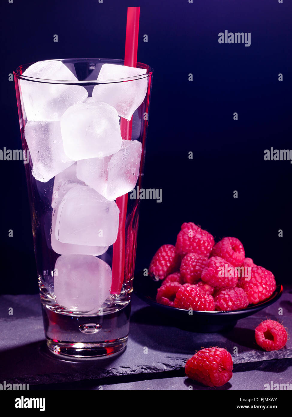 Red raspberry drink on black background Stock Photo - Alamy