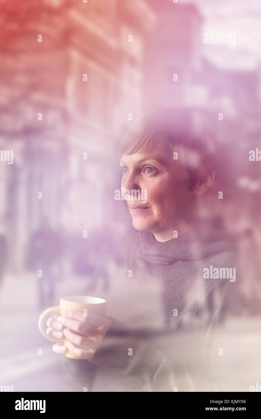 Beautiful caucasian adult woman drinking cup of coffee, Double Exposure ...