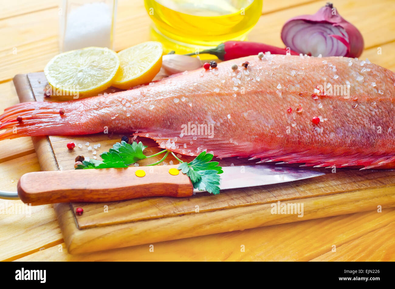 raw fish with aroma spice on wooden background Stock Photo - Alamy