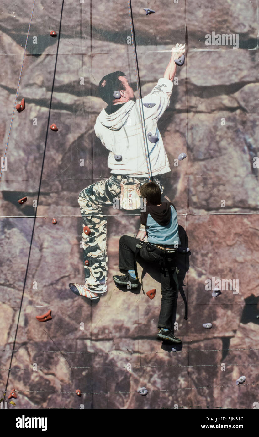 A boy climbing on a climbing wall Stock Photo - Alamy
