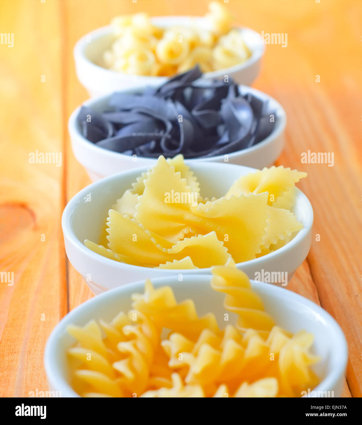 Raw pasta, different kaind from color pasta Stock Photo - Alamy
