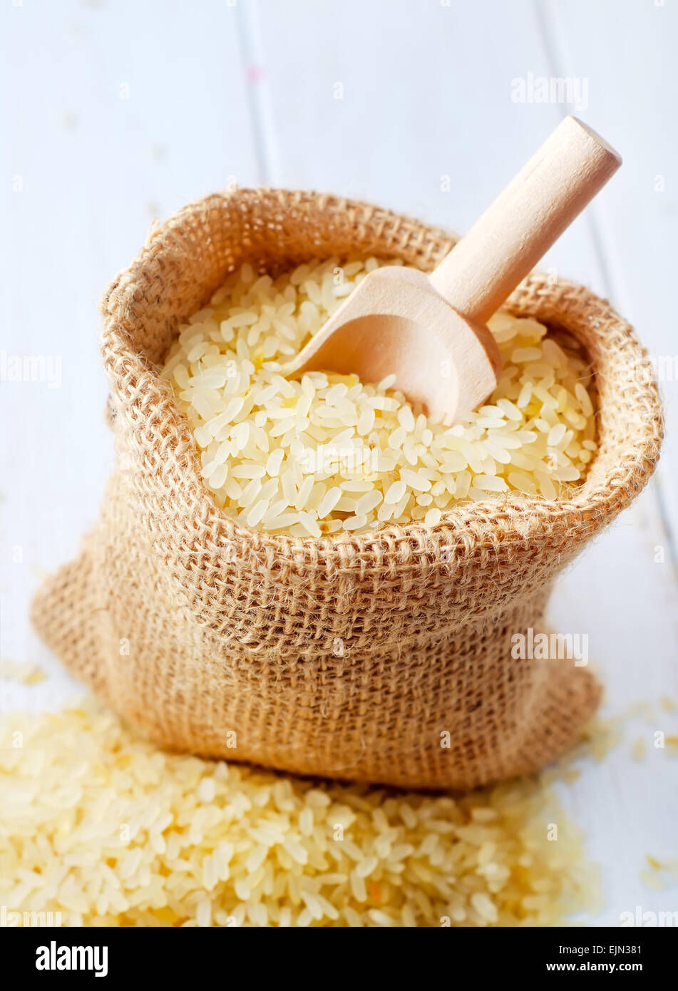Raw rice on the table, portion of the raw rice Stock Photo - Alamy