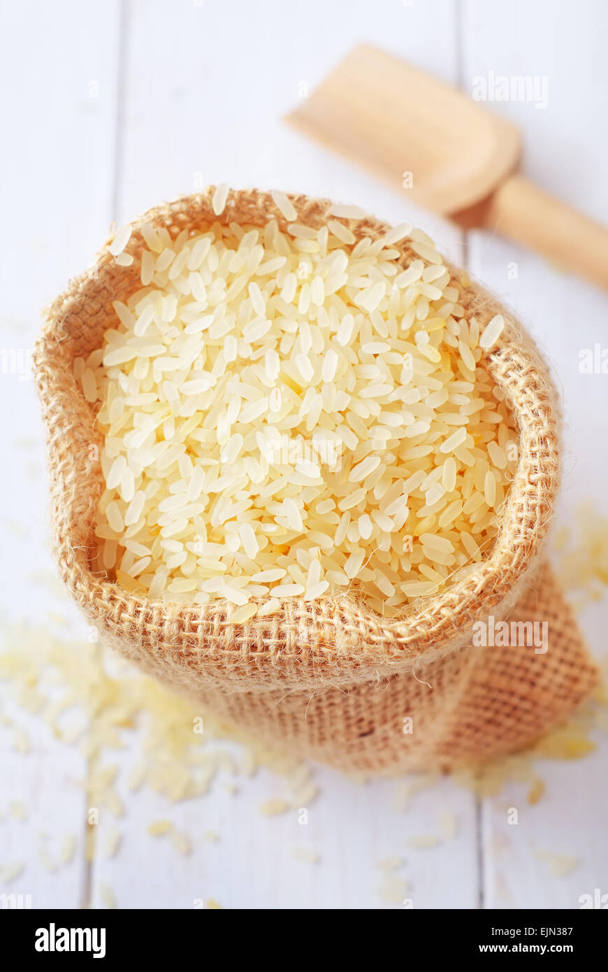 Raw rice on the table, portion of the raw rice Stock Photo - Alamy