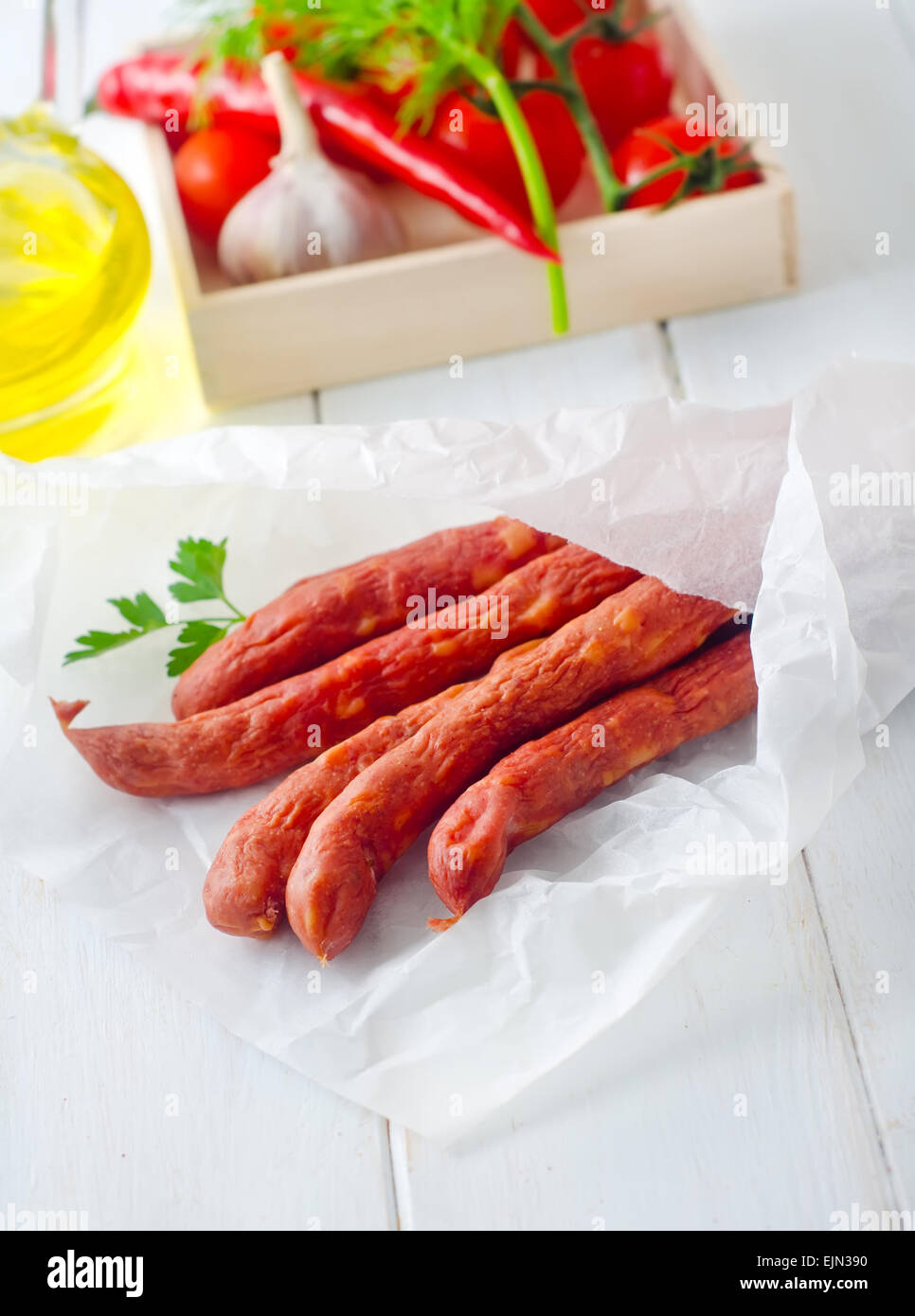 sausages in paper, vegetables in the box Stock Photo - Alamy