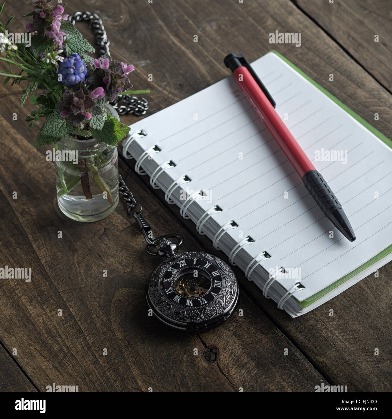 notebook, pen and old watch on working desk Stock Photo - Alamy