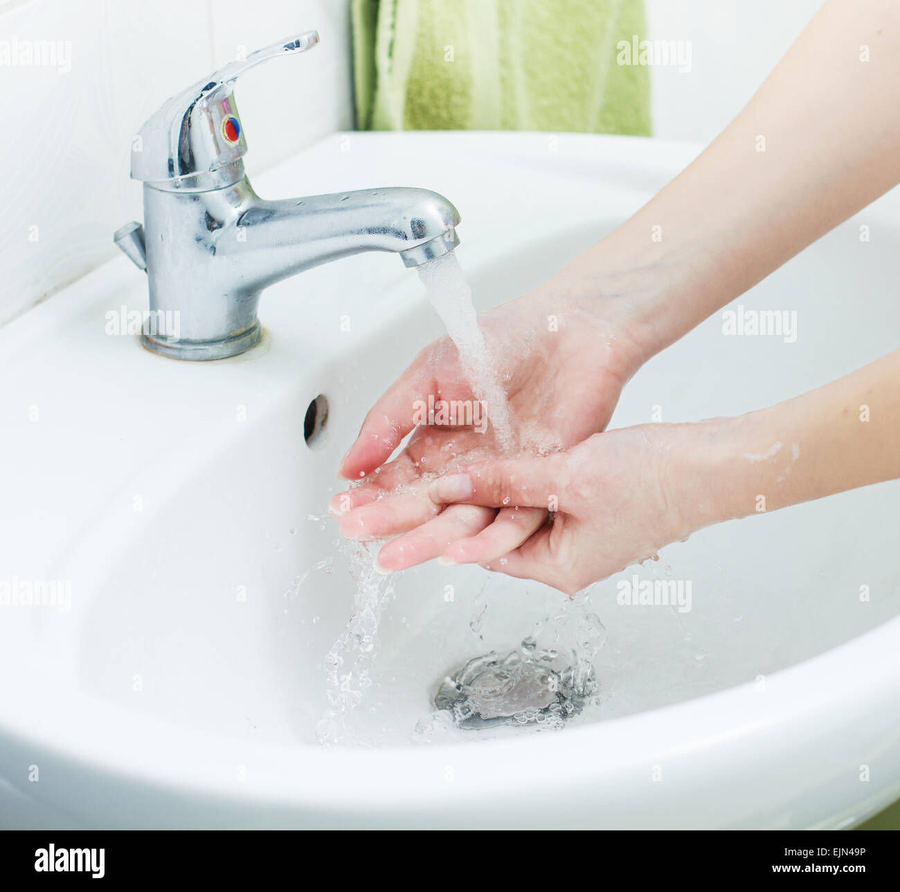 Washing Hands with streaming water in bathroom. Hygiene Stock Photo - Alamy