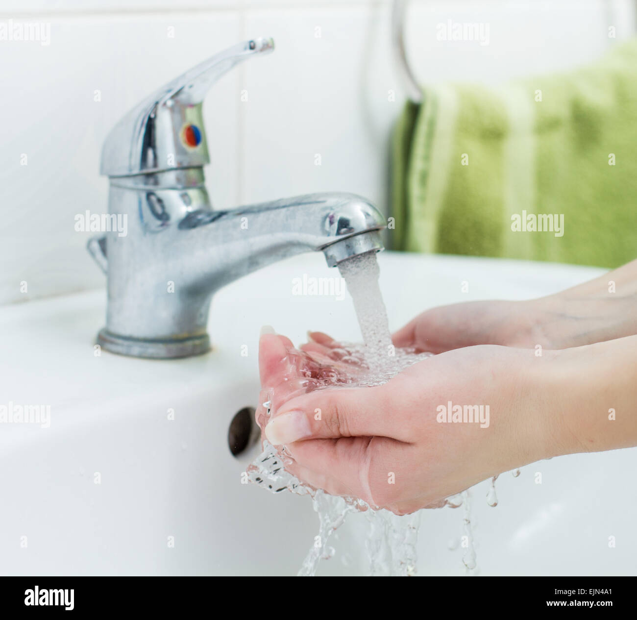 Washing Hands with streaming water in bathroom. Hygiene Stock Photo - Alamy