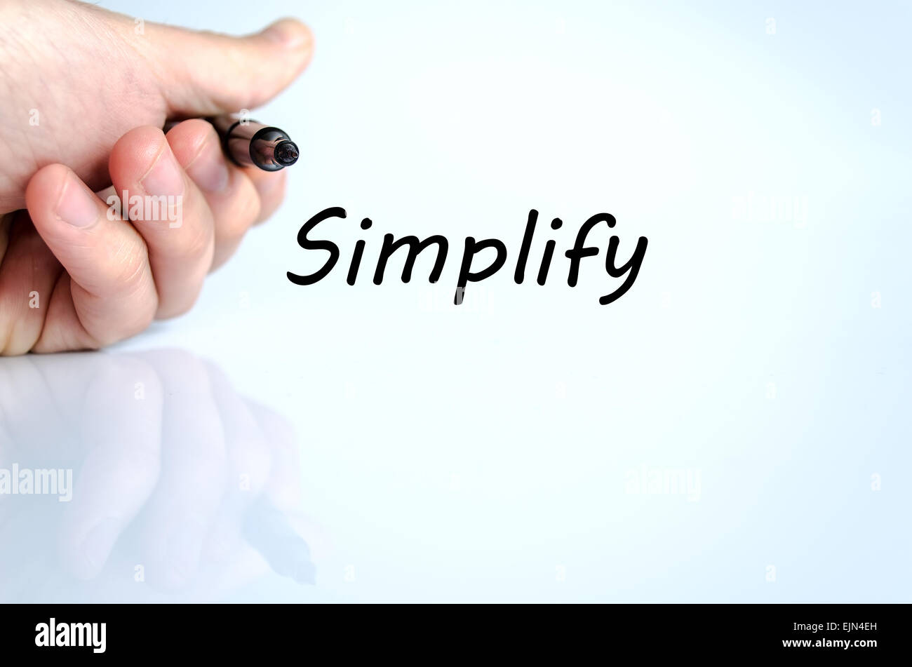 Human hand writing Simplify isolated over white background - business ...