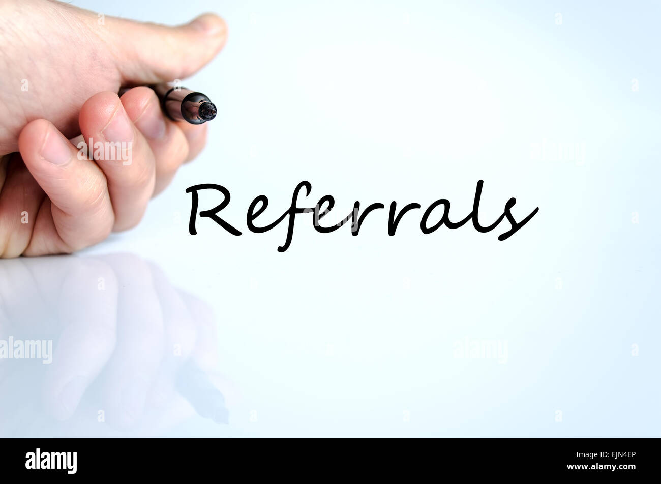 Human hand writing Referrals isolated over white background - business ...