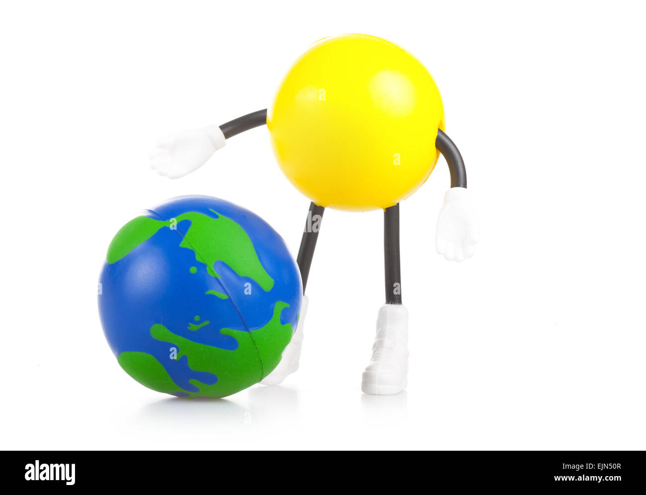 toy little man rolls forward globe. It is isolated, a white background ...