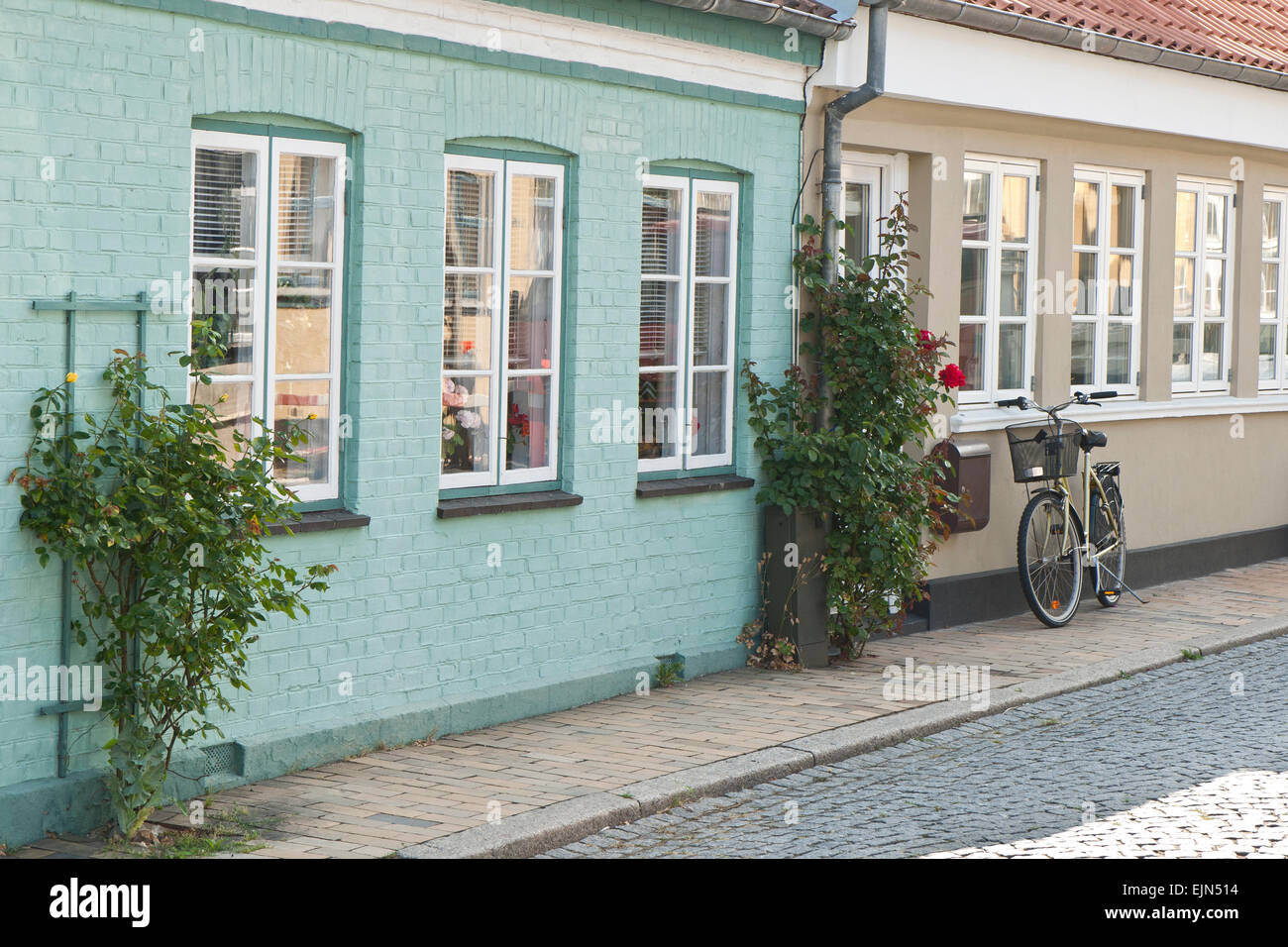 Bicycle at a letter box in a small street in Svendborg, Denmark Stock ...