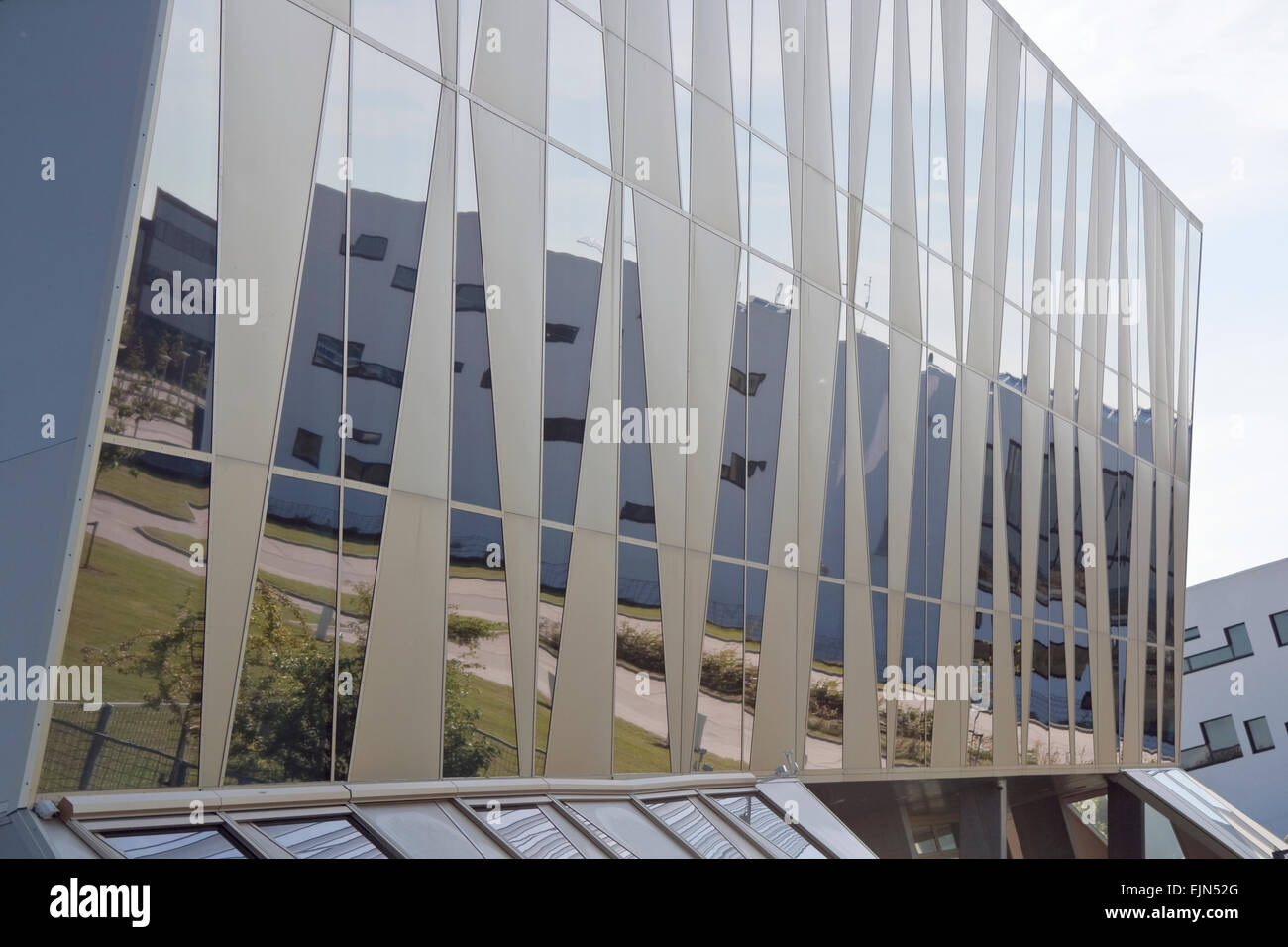 Reflection in the windows of a modern office building Stock Photo - Alamy