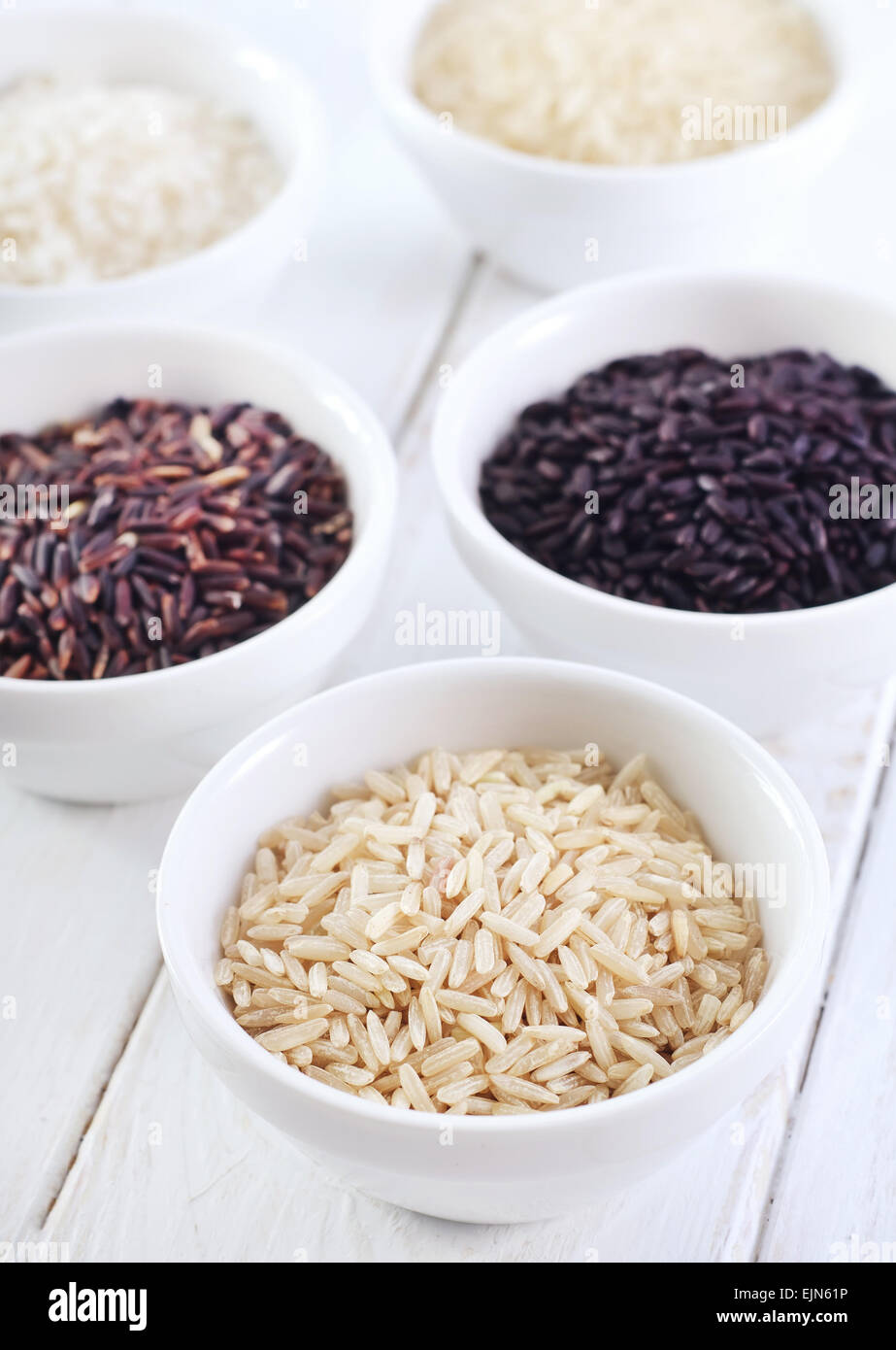 Different kind of raw rice, raw rice in the white bowls Stock Photo - Alamy