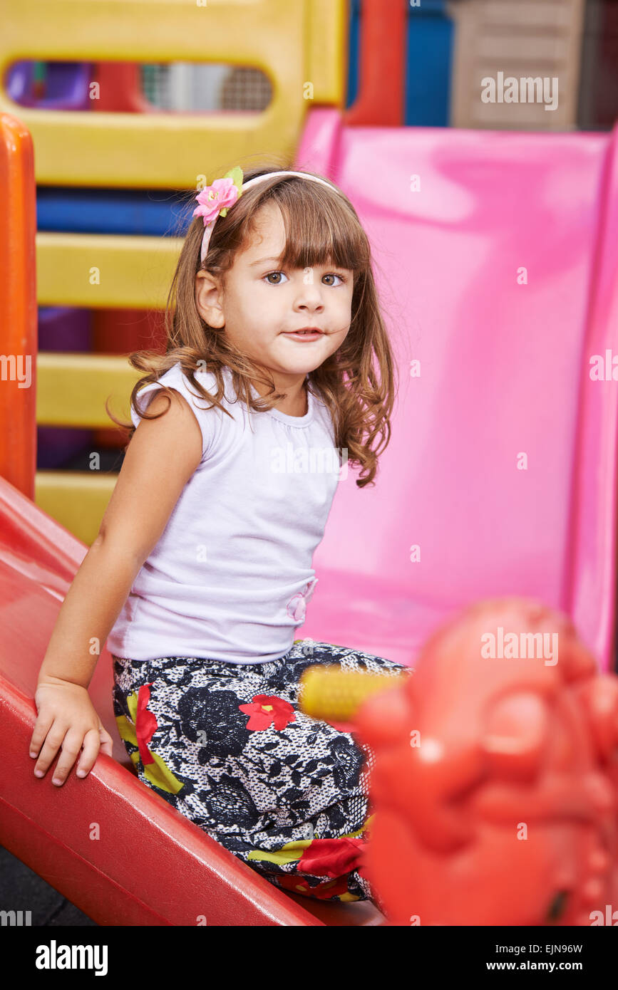 Happy child playing inside on a slide Stock Photo - Alamy Happy child playing inside on a slide Stock Photo - Alamy