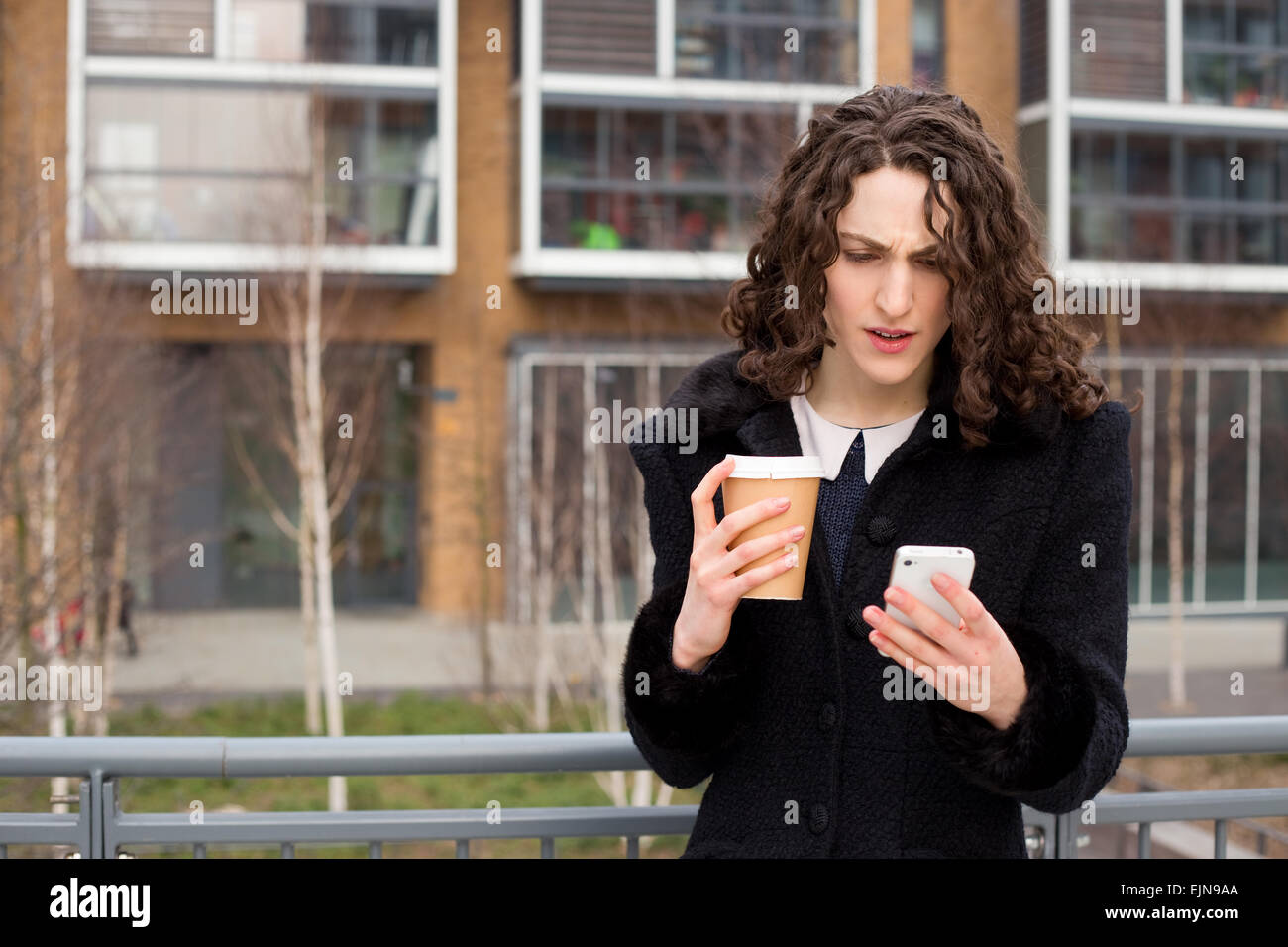young woman reading her text messages Stock Photo - Alamy