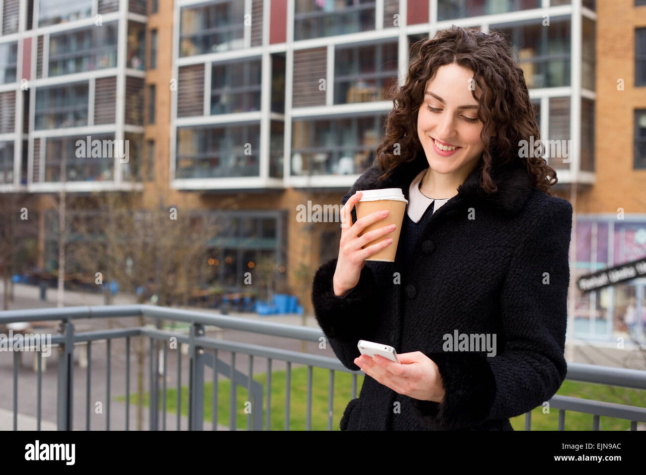 young woman reading her text messages Stock Photo - Alamy