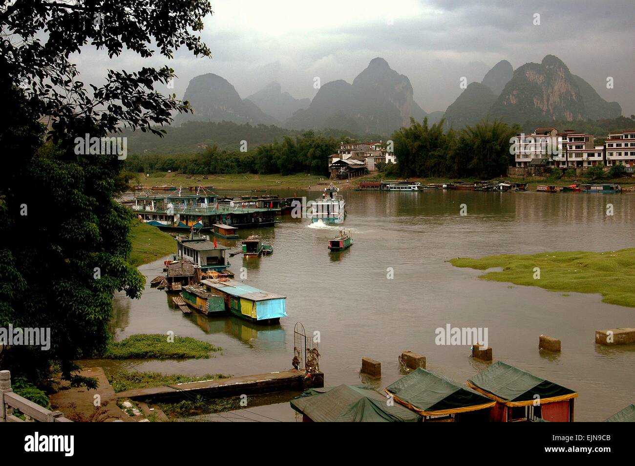 Yangshuo, China: Dramatic karst rock formations rise behind the Lijiang ...