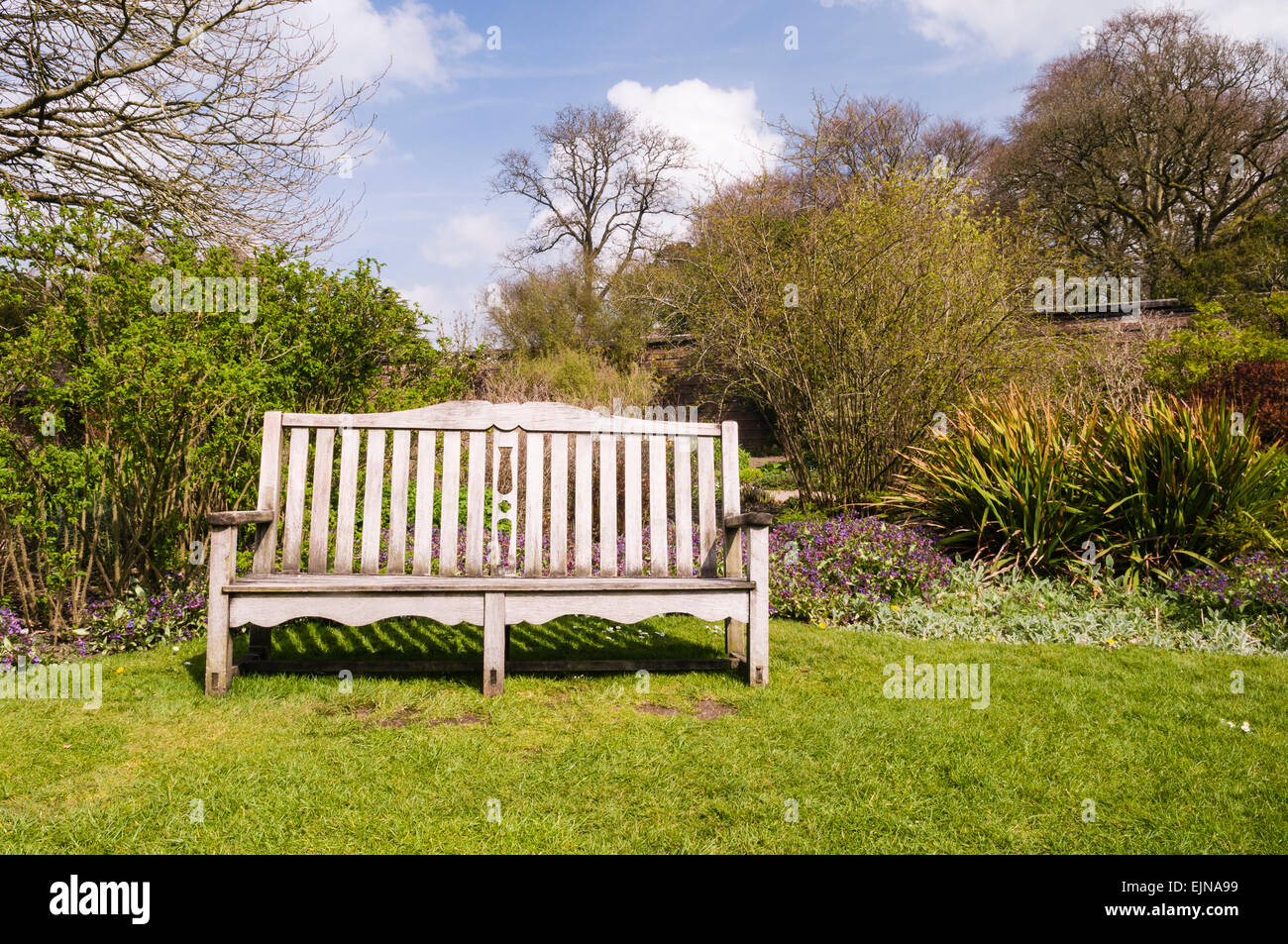 Garden bench in a formal walled garden Stock Photo - Alamy