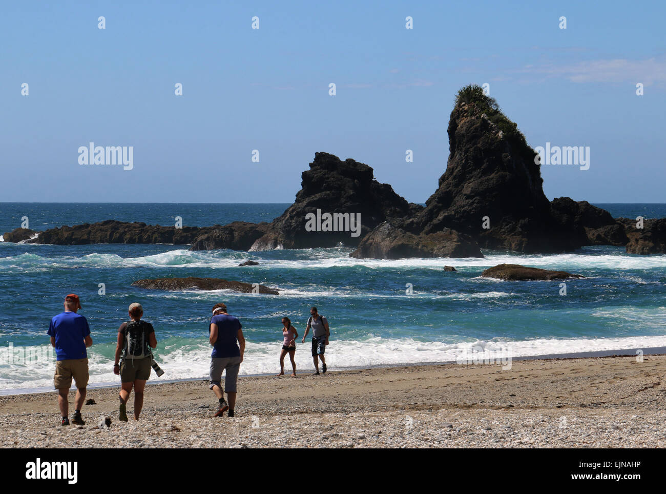 Hikers on Monro beach New Zealand Stock Photo - Alamy