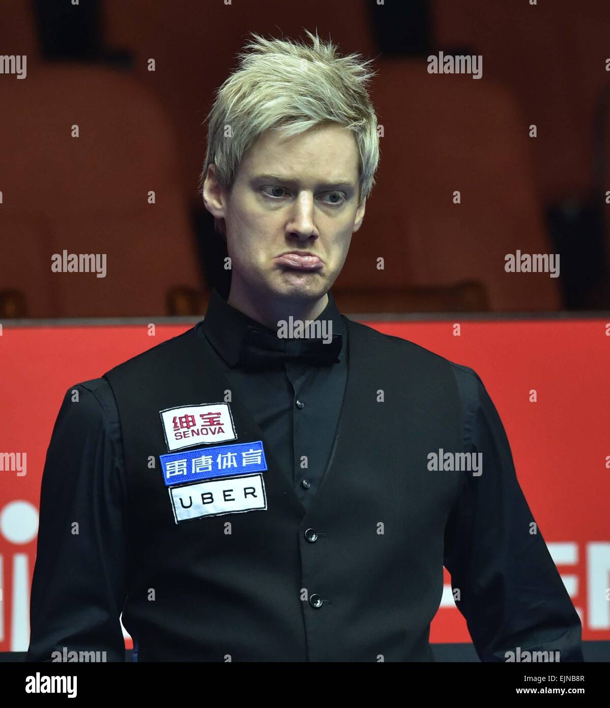 Beijing, China. 30th Mar, 2015. Neil Robertson of Australia reacts ...