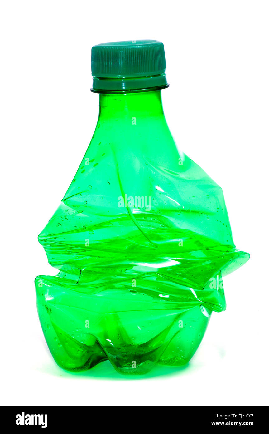 smashed green plastic bottle, on a white background Stock Photo - Alamy