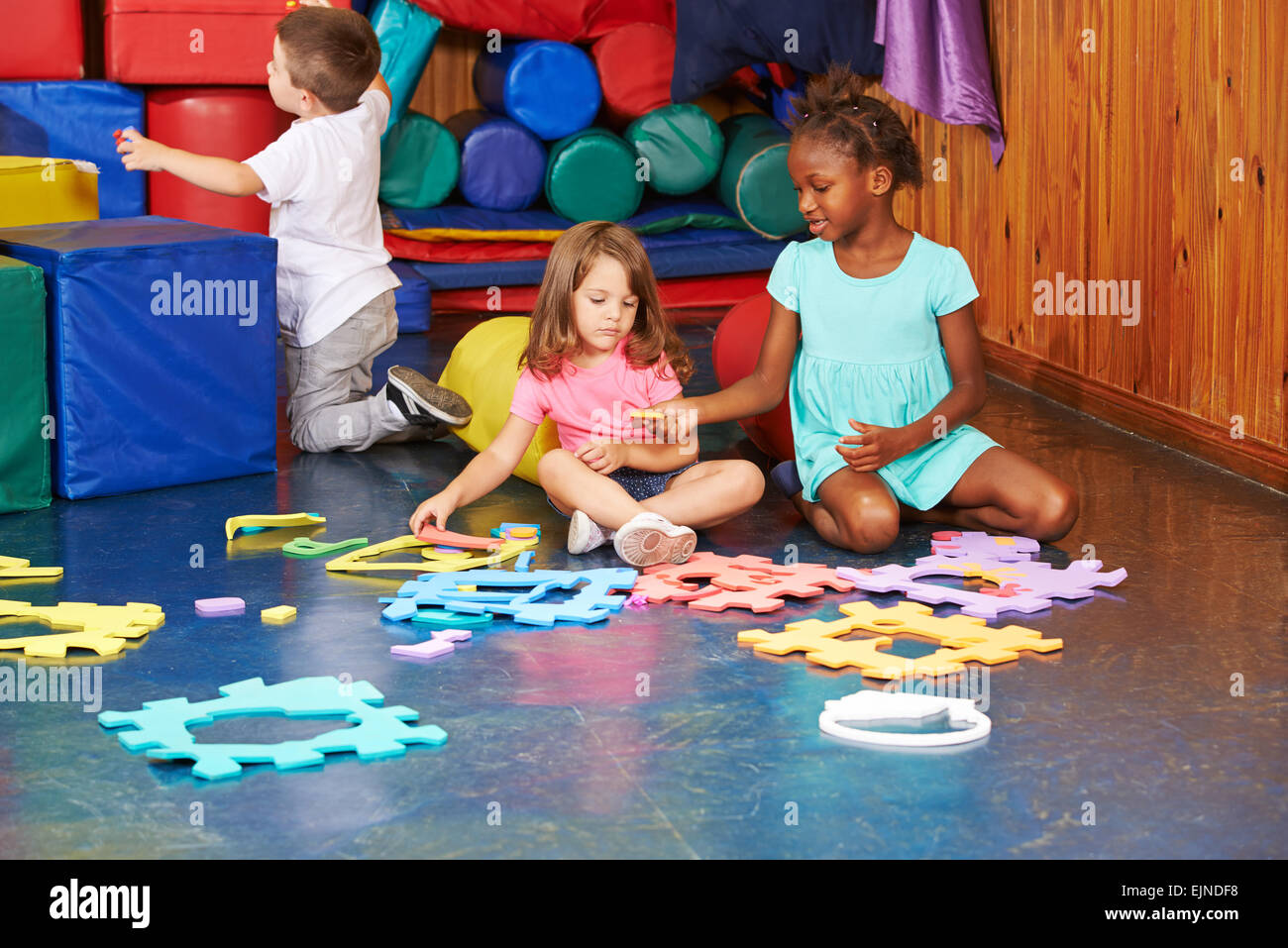 Group of children playing together in a kindergarten Stock Photo - Alamy