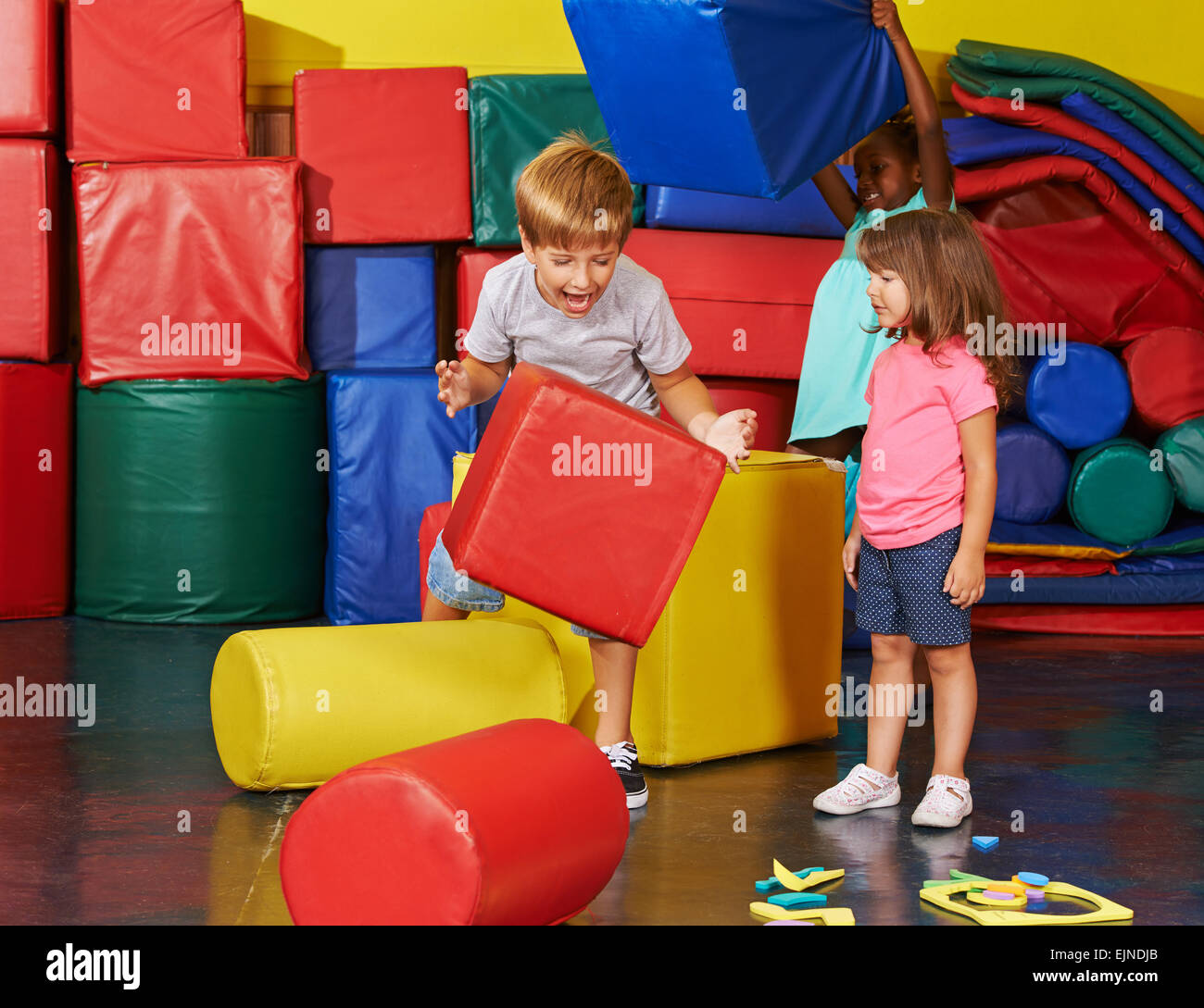 Happy children playing together in gym of a preschool Stock Photo - Alamy