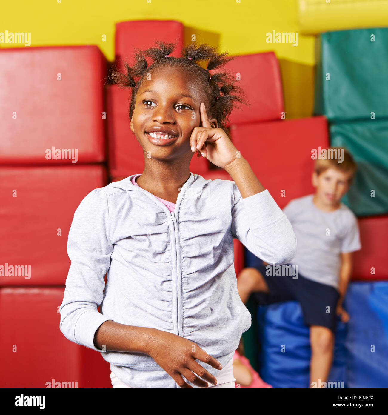 Pensive african child having an idea while thinking in a kindergarten ...