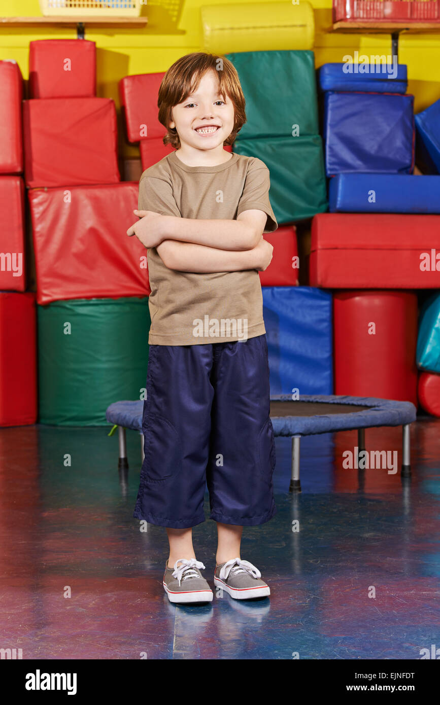 Happy child with his arms crossed in gym during kids gymnastics Stock ...