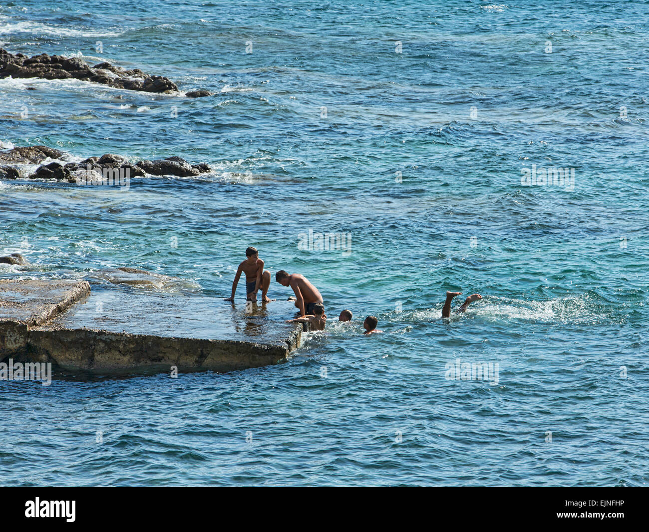 Mykonos, Greece boys swimming Mediterranean Sea Stock Photo - Alamy