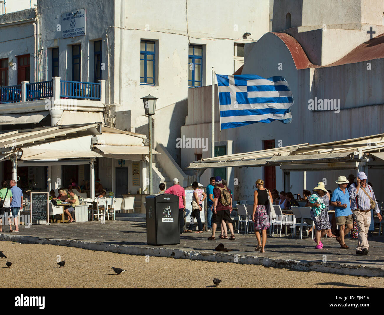 Mykonos, Greece flag tourist cafe and stores Stock Photo - Alamy