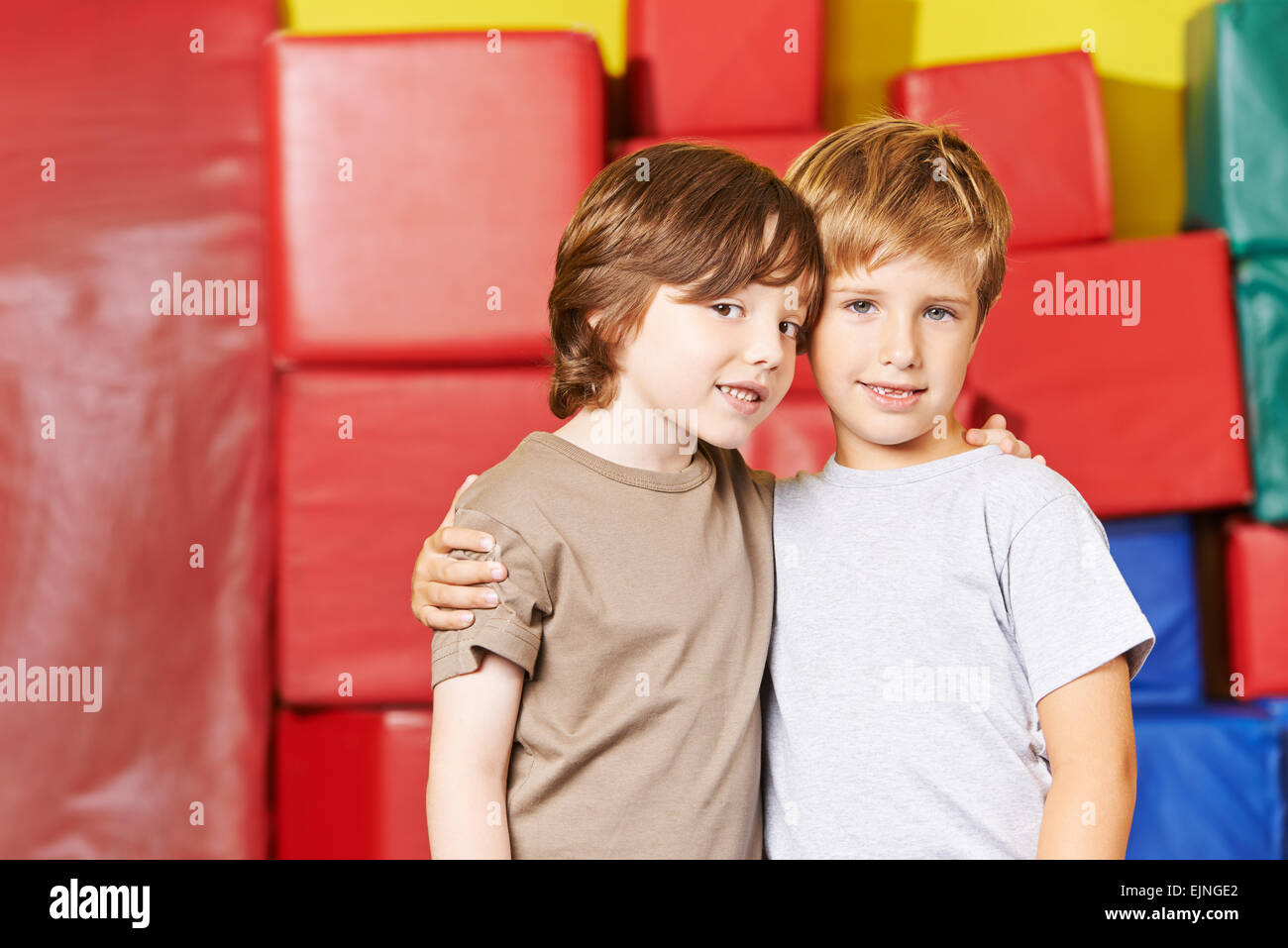 Two boys are friends in gym of a preschool Stock Photo - Alamy