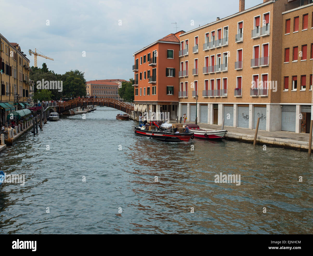 Venice, Italy canal work boats modern apartments Stock Photo - Alamy