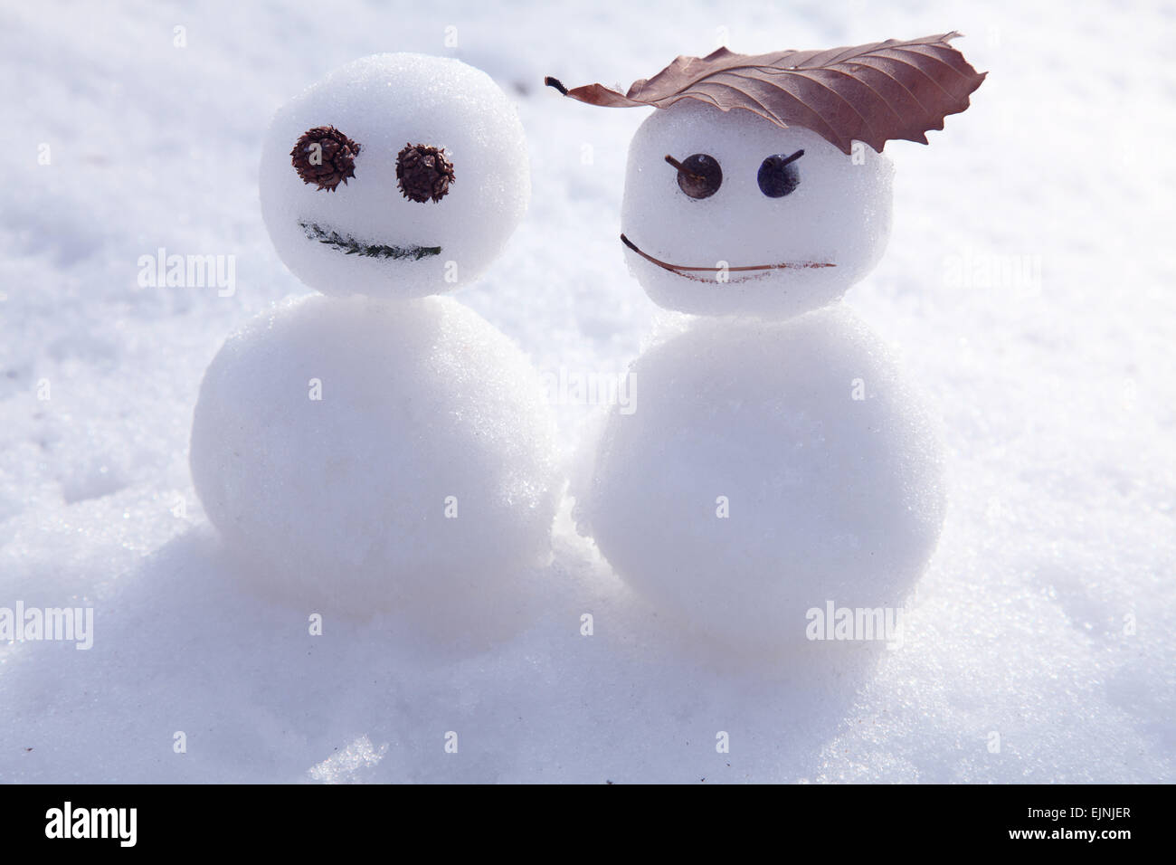 Two people with snowmen hi-res stock photography and images - Alamy