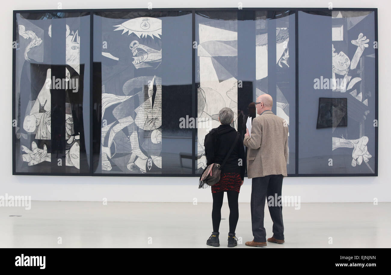 Hamburg, Germany. 30th Mar, 2015. Visitors look at the work 'Guernica ...