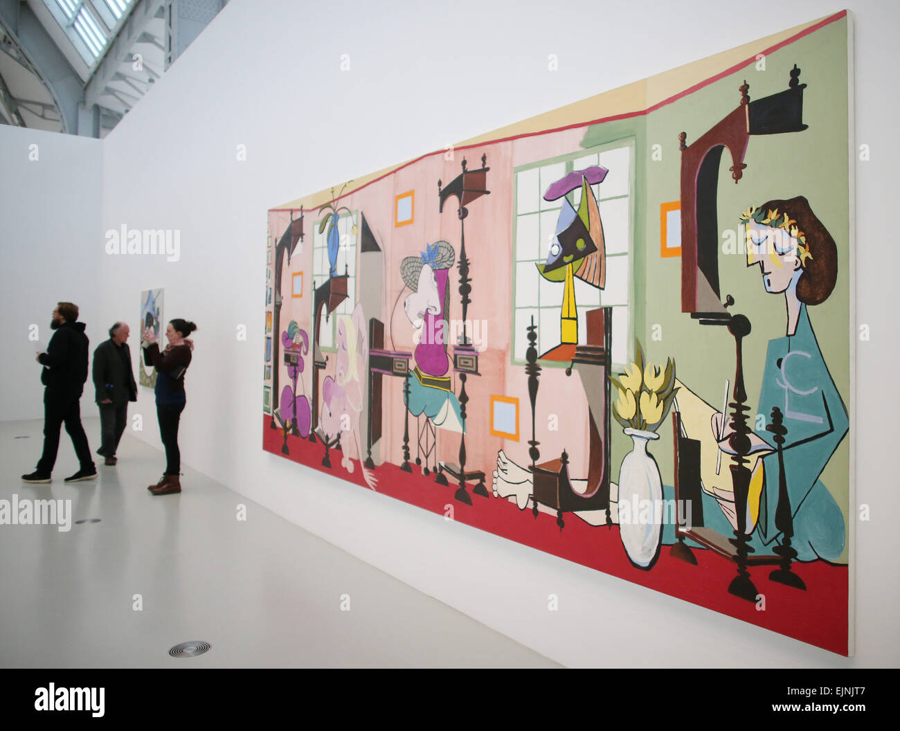 Visitors stand contemporary painting hi-res stock photography and ...