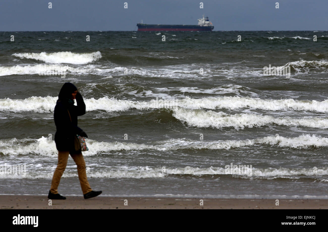 Rostock-Warnemuende, Germany. 30th Mar, 2015. People take a walk at the ...
