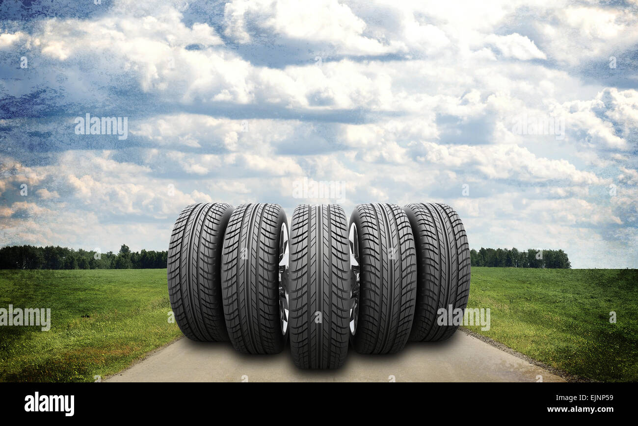 Wedge of new car wheels on road stretches into the distance Stock Photo ...