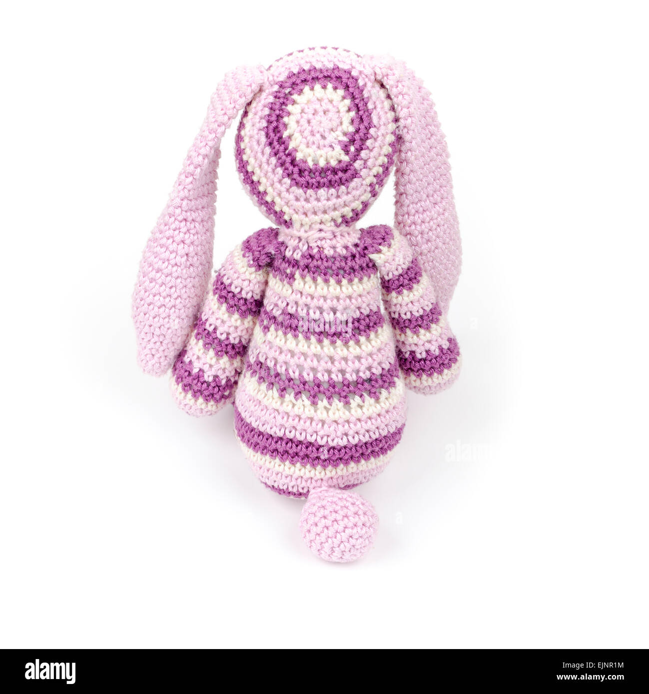 Knitted rabbit toy sitting isolated on white background, back view ...