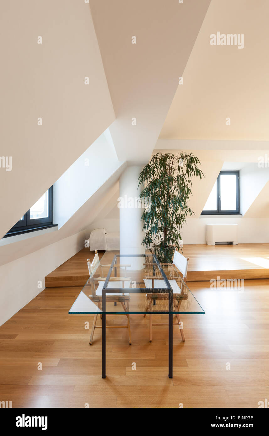 Interior, wide loft, hardwood floor, view dining table Stock Photo - Alamy