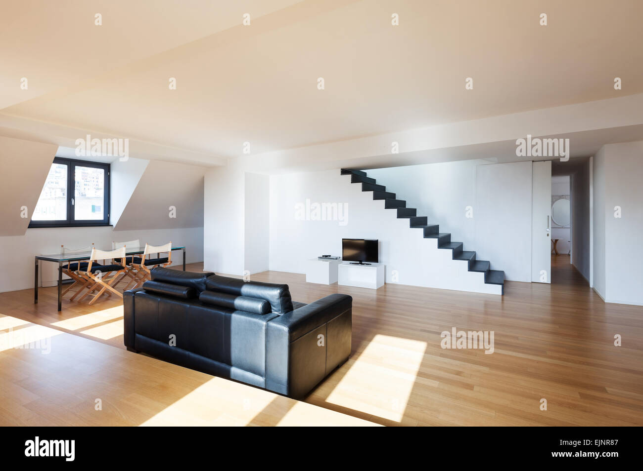 Interior, wide loft, hardwood floor, view living room Stock Photo - Alamy