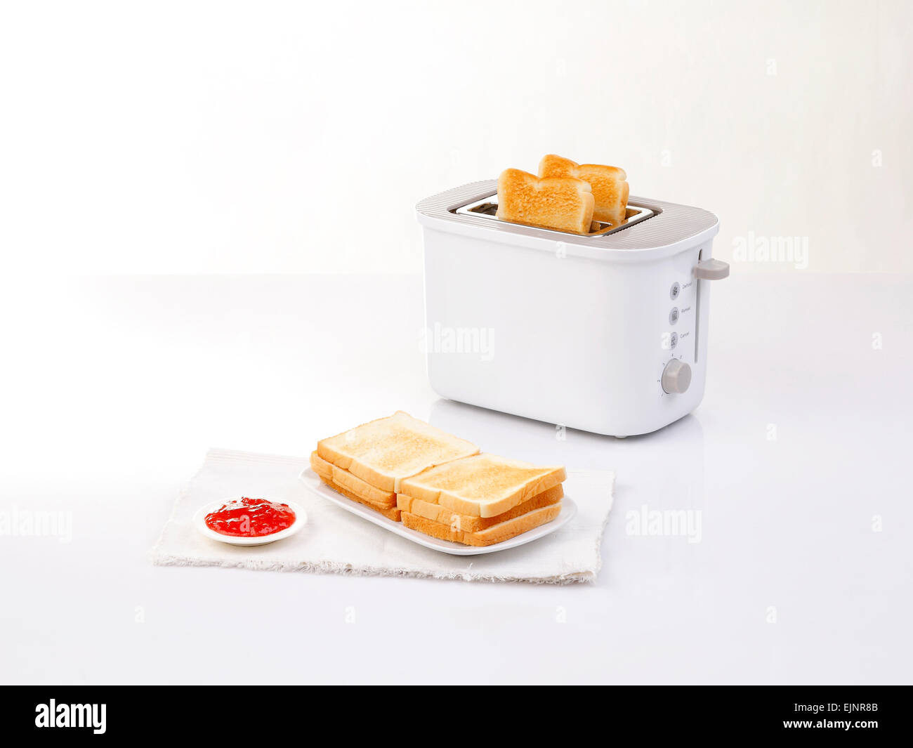 bread toaster and toasted bread served with jam Stock Photo - Alamy