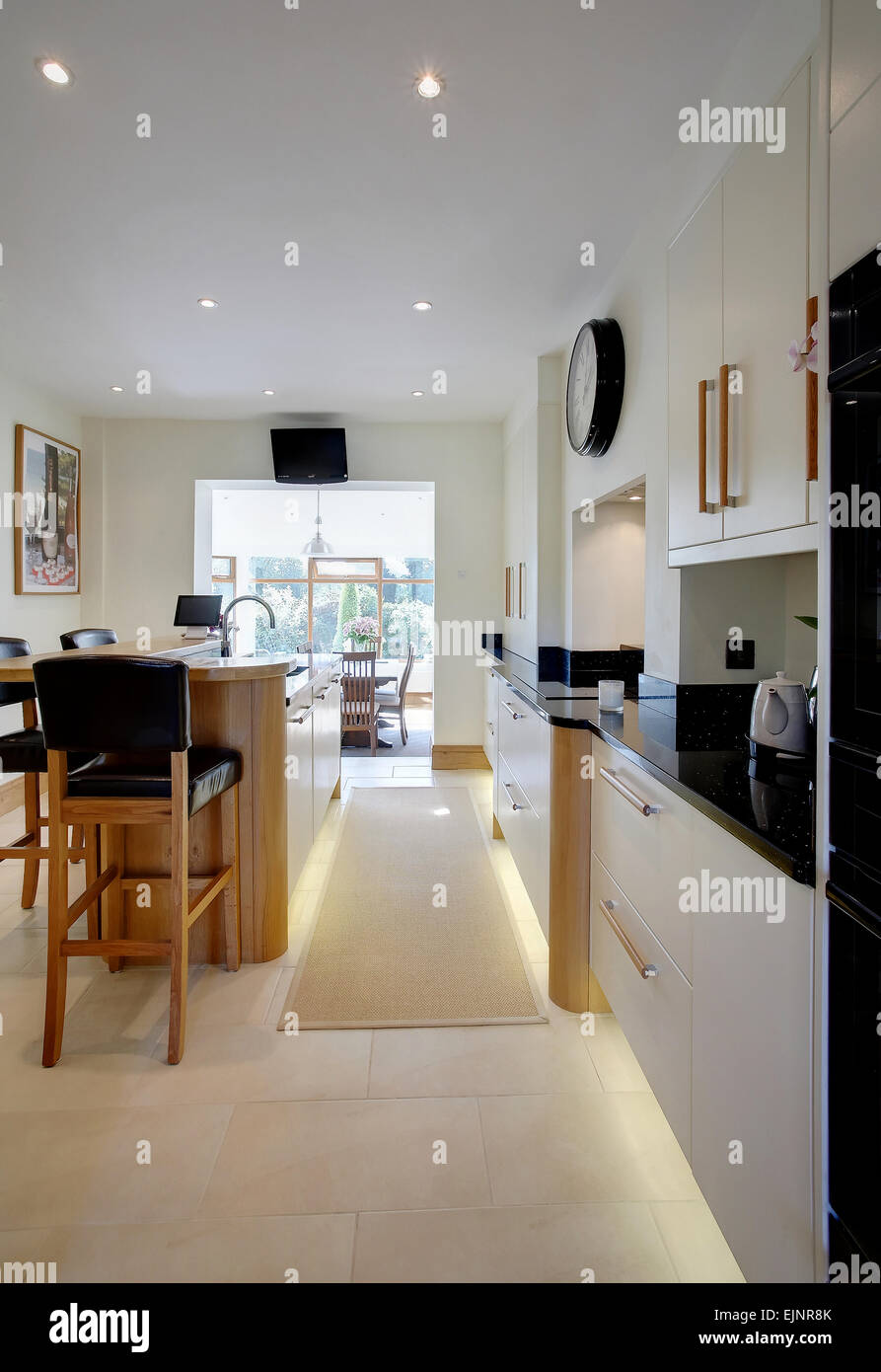 A modern cream kitchen inside a home in the UK Stock Photo - Alamy