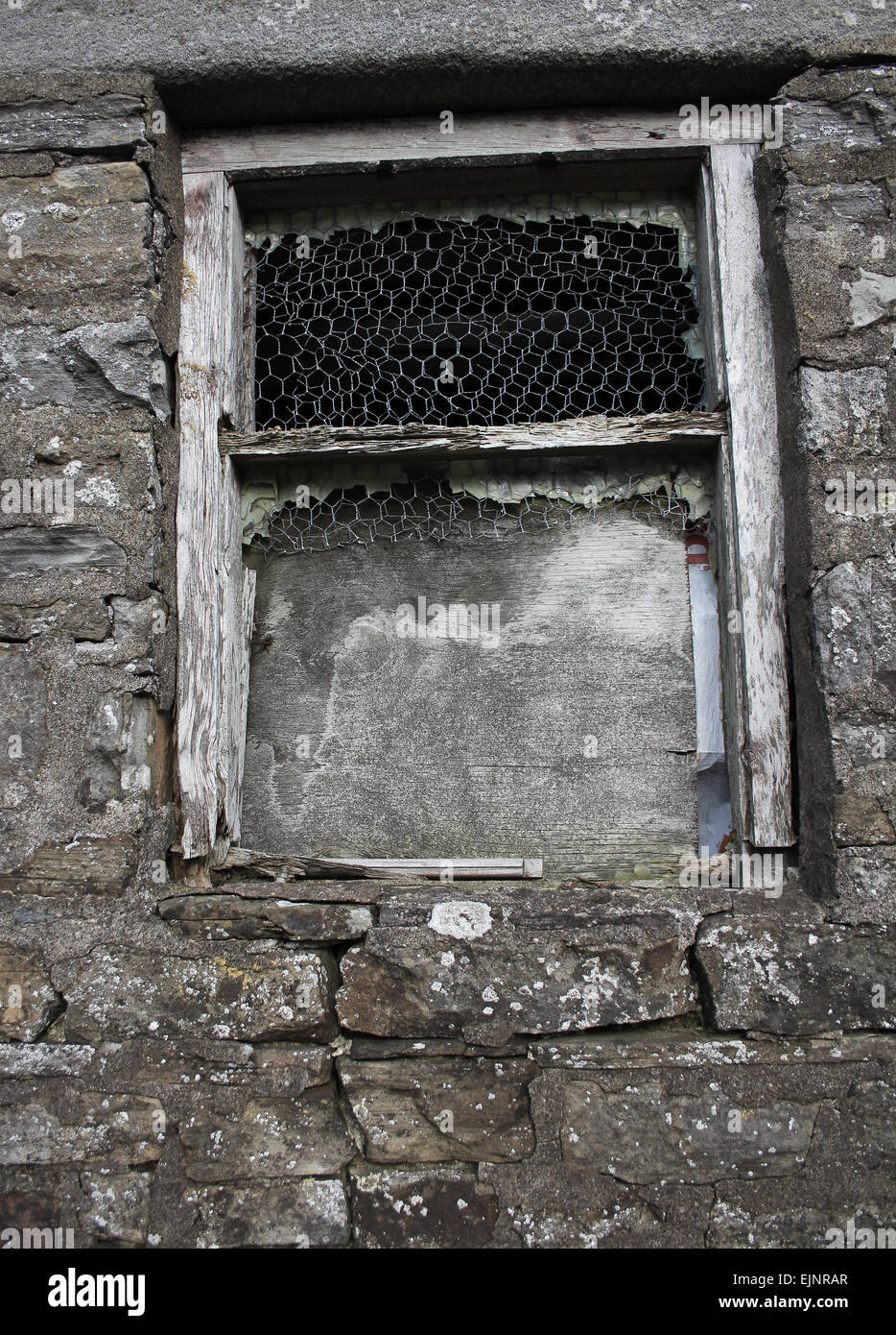 rotten window frame in stone barn Stock Photo - Alamy