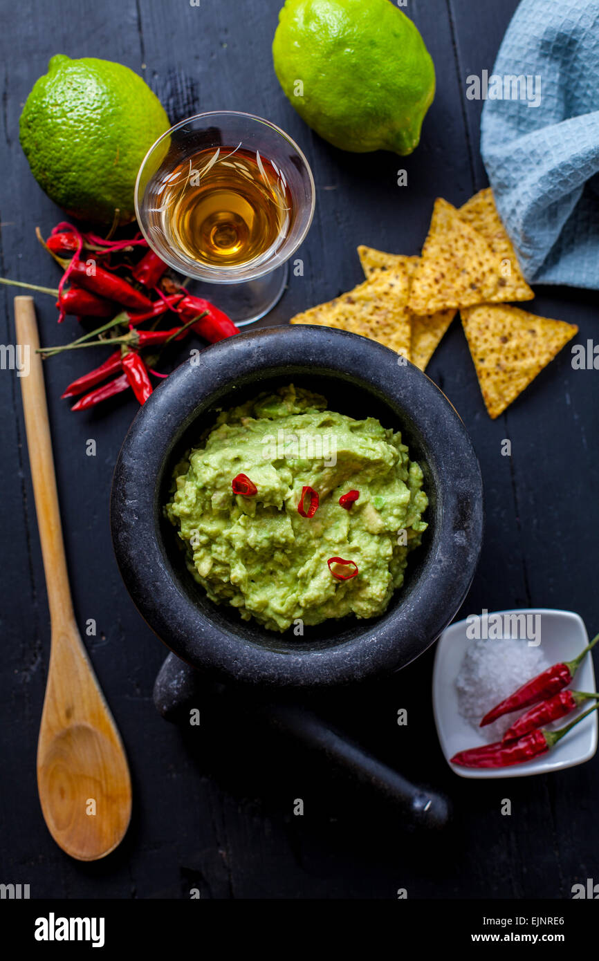 black stone bowl with fresh guacamole and nachos for dip Stock Photo ...