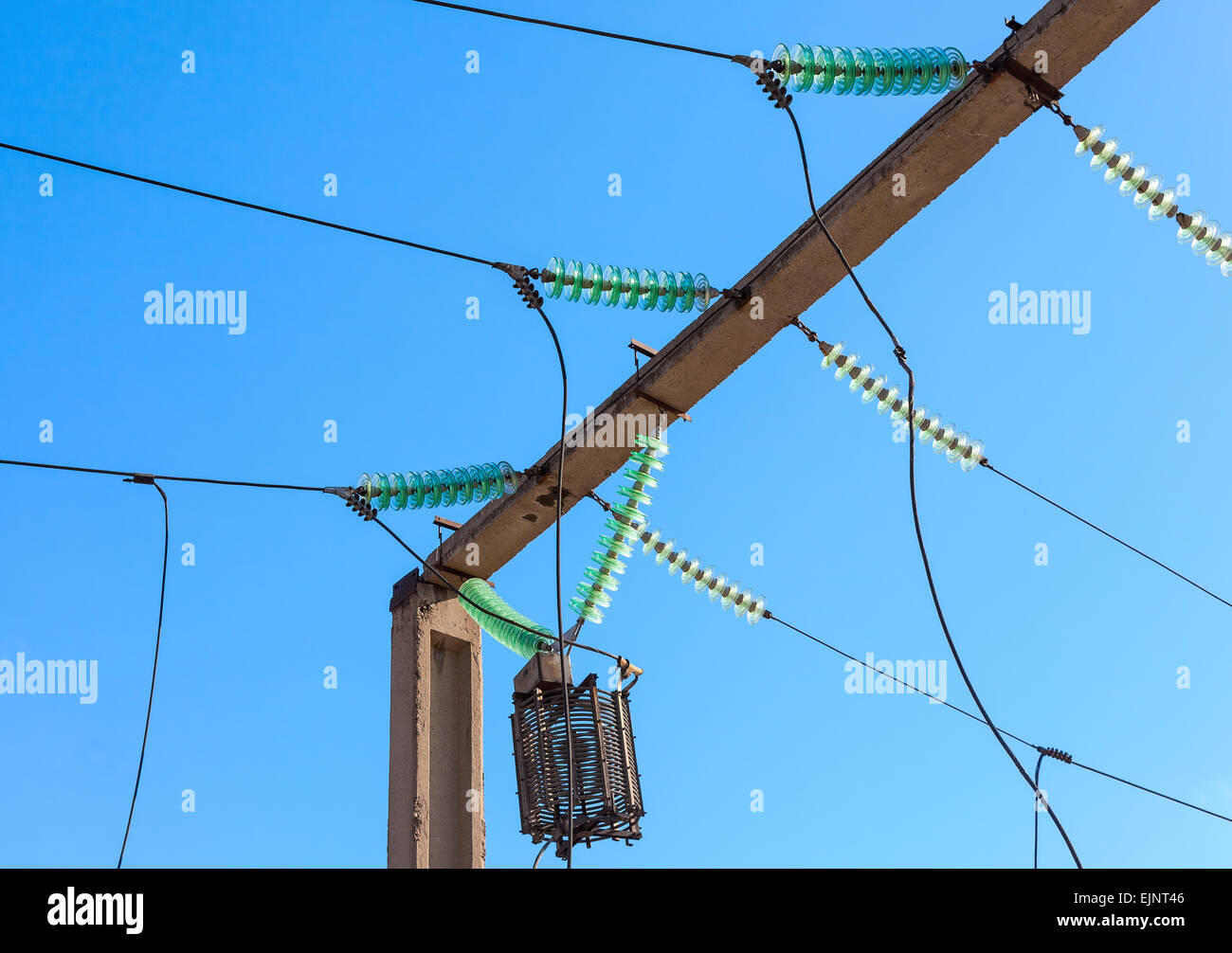 Power line wiring and insulators system over blue sky Stock Photo - Alamy