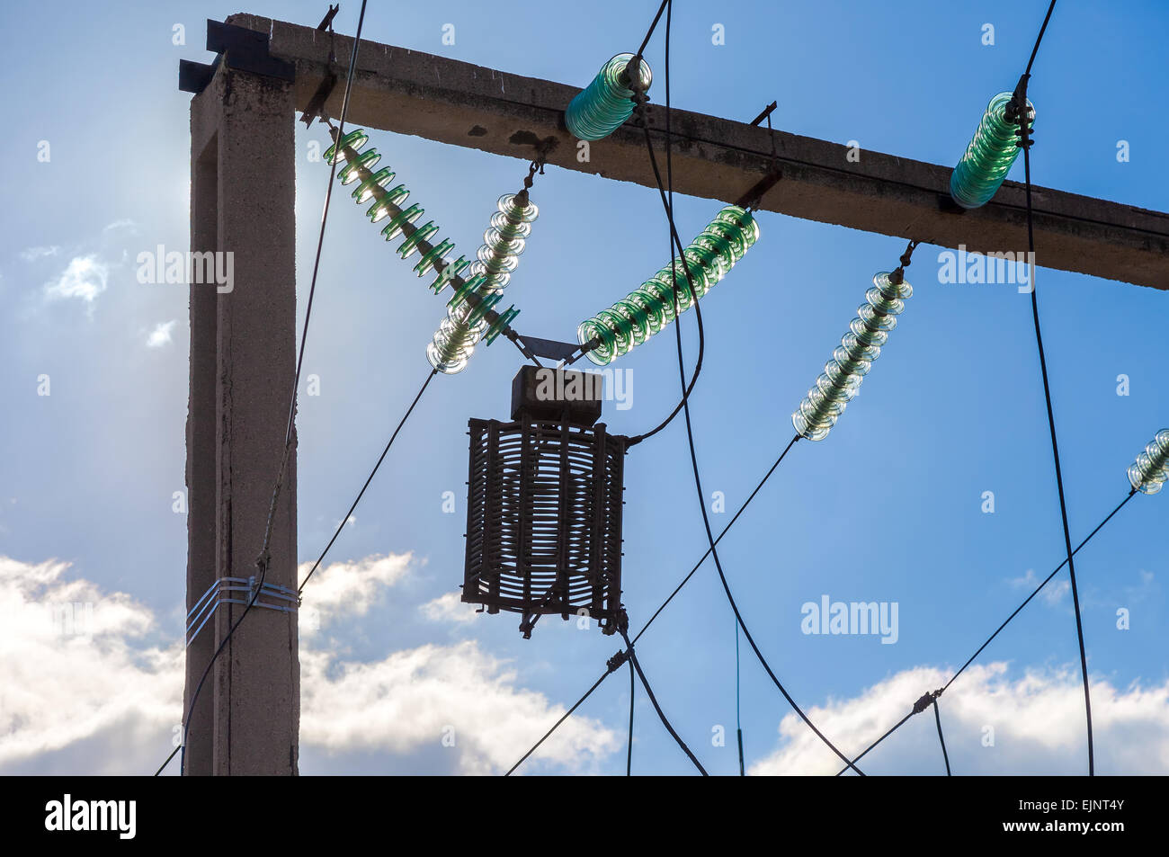 Power line wiring and insulators system over blue sky Stock Photo - Alamy